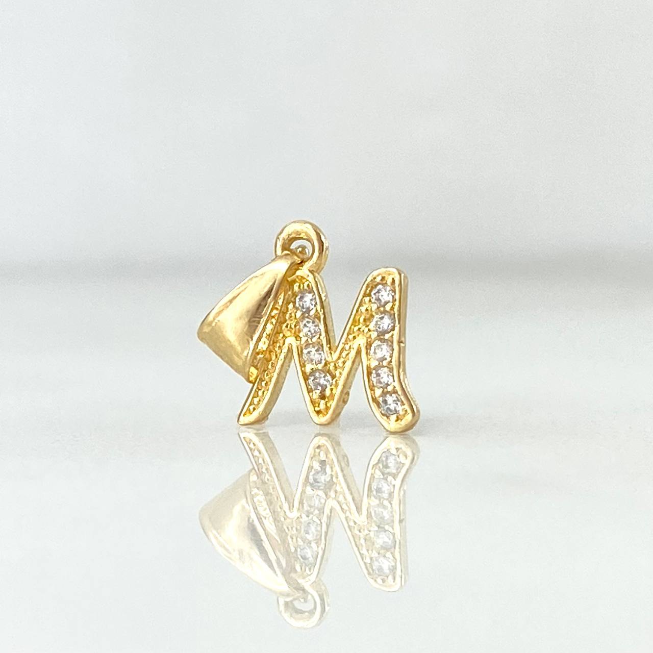 Dije Letra M Silueta 0,45gr, 18K Oro Nacional – Napoleone Joyas